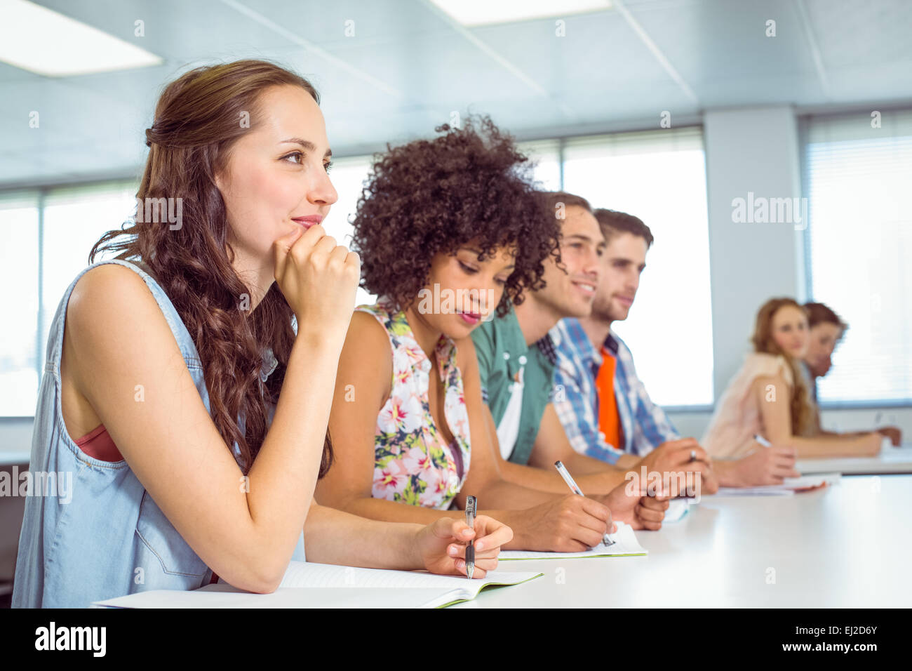 Fashion students taking notes in class Stock Photo - Alamy