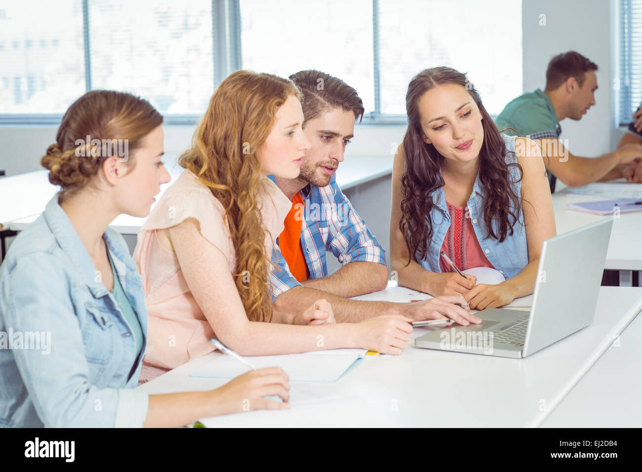 Fashion students taking notes in class Stock Photo - Alamy