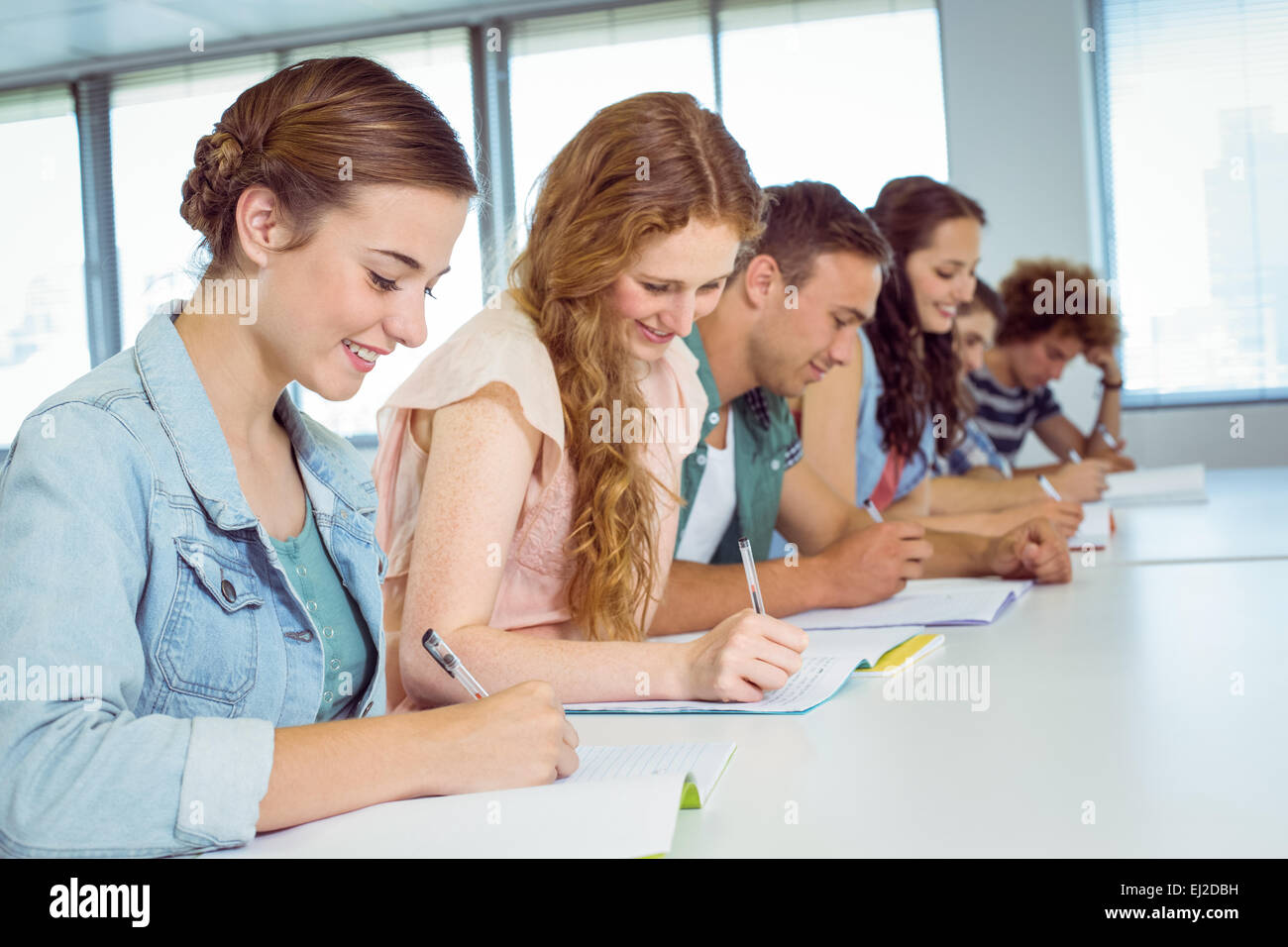 Fashion students taking notes in class Stock Photo - Alamy