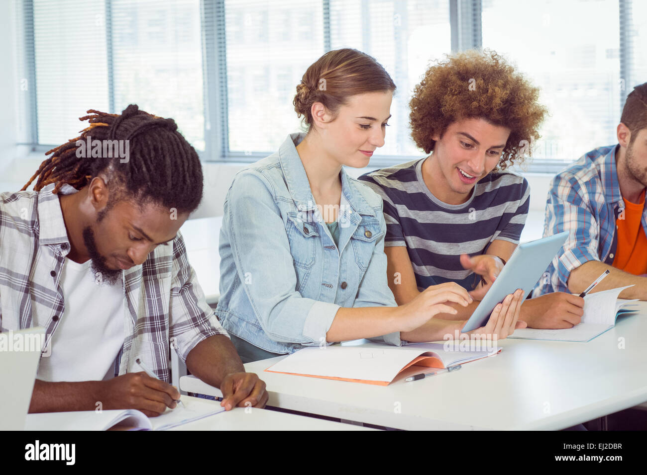 Fashion students using tablet Stock Photo - Alamy