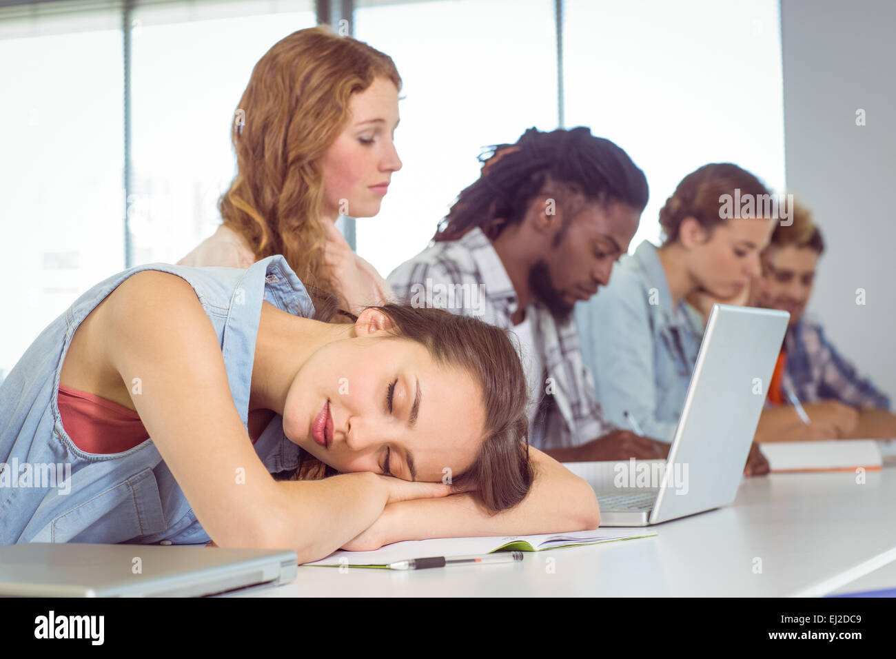 Student dozing during a class Stock Photo - Alamy