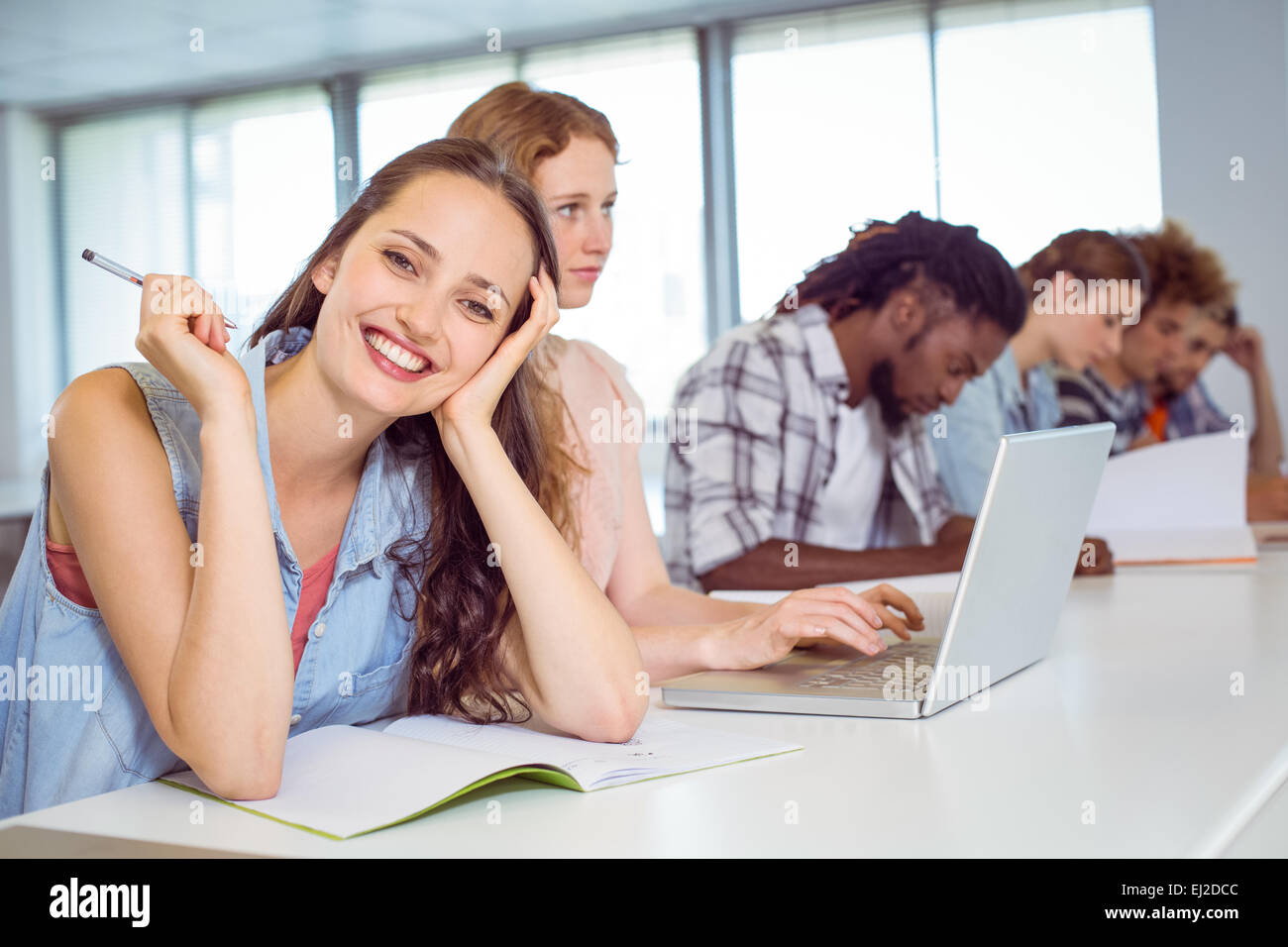 Fashion student smiling at camera Stock Photo - Alamy