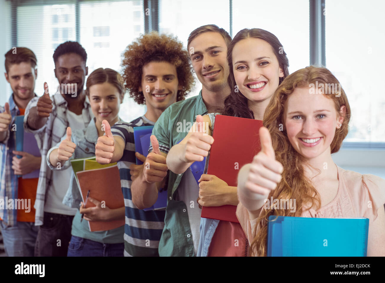 Hands up in class room students hi-res stock photography and images - Alamy
