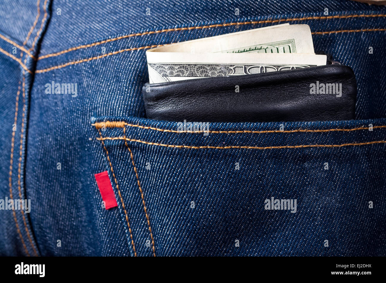 Cash sticking out wallet hi-res stock photography and images - Alamy