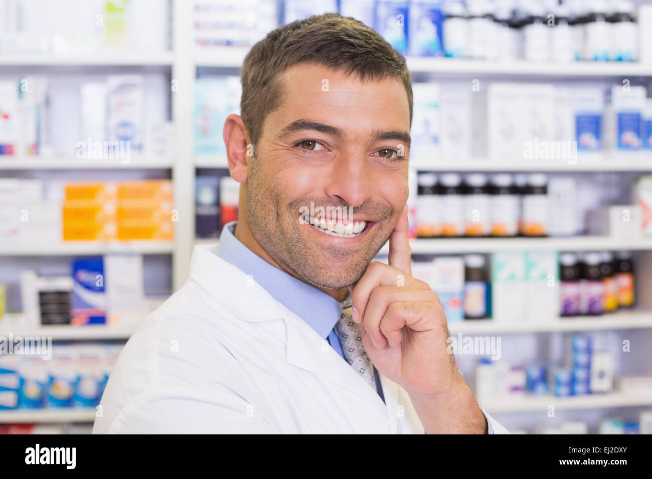 Smiling cheerful male pharmacist hi-res stock photography and images ...