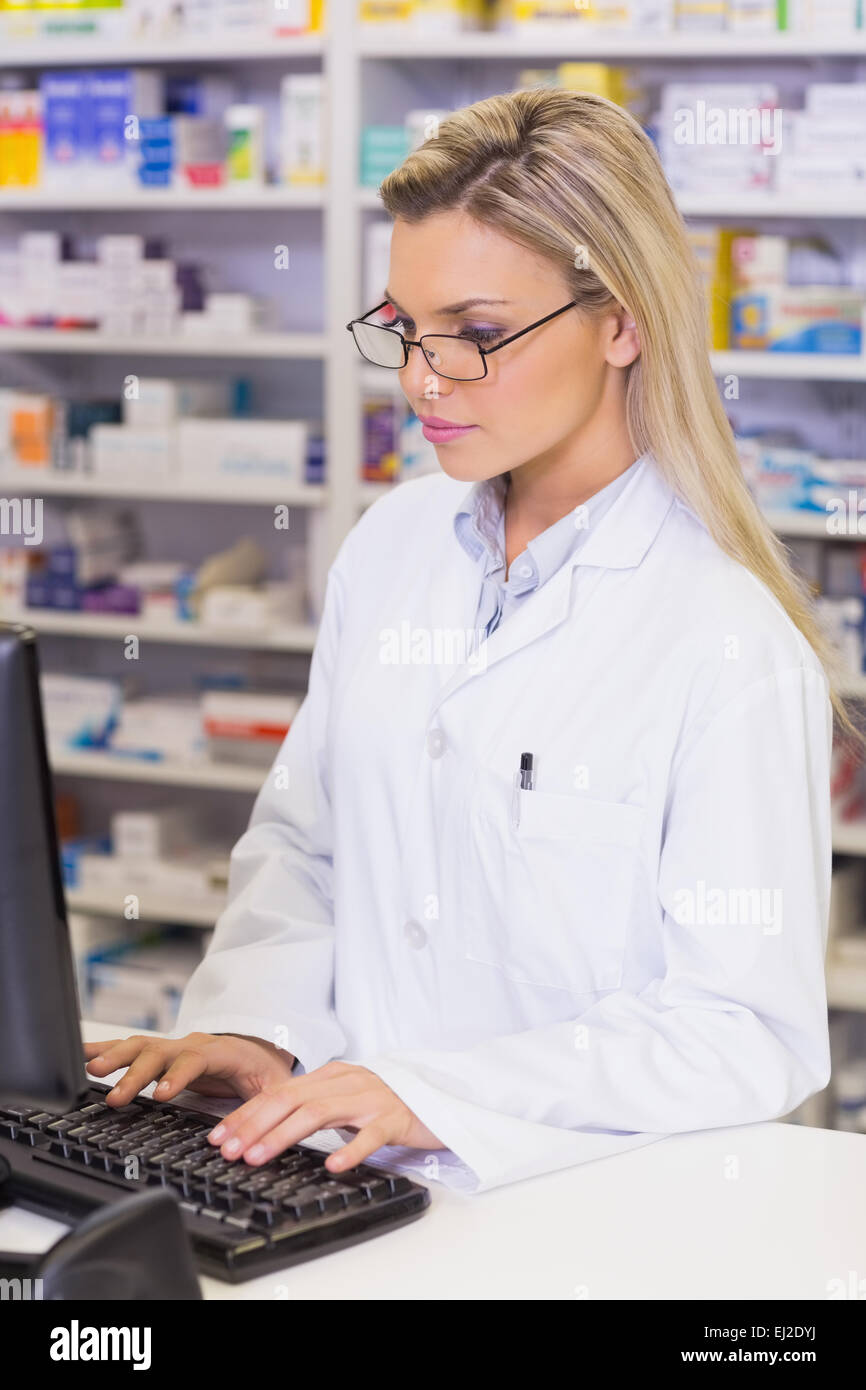 Pharmacist using the computer Stock Photo - Alamy