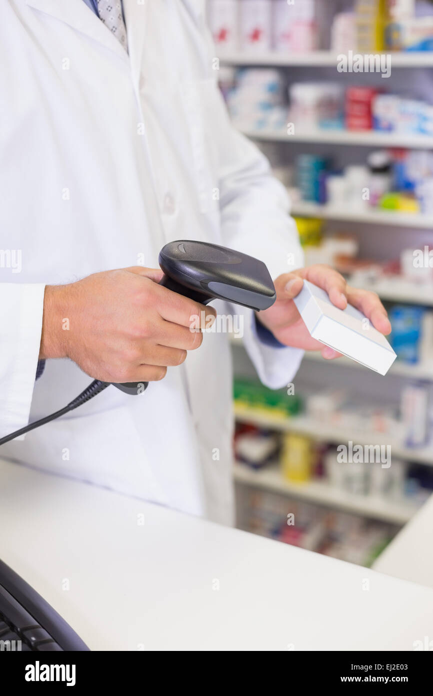 Pharmacist scanning medicines Stock Photo - Alamy