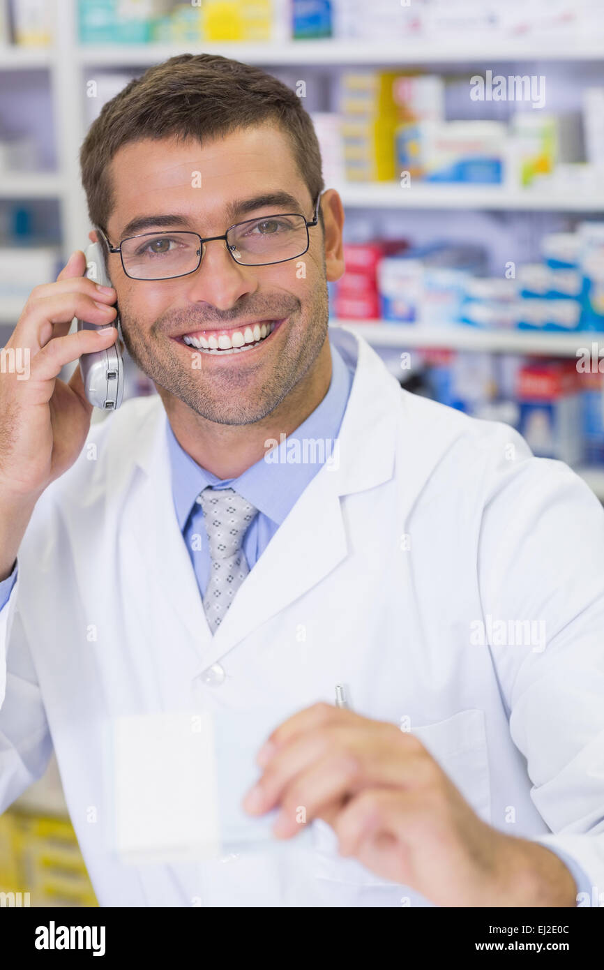 Happy pharmacist on the phone Stock Photo - Alamy