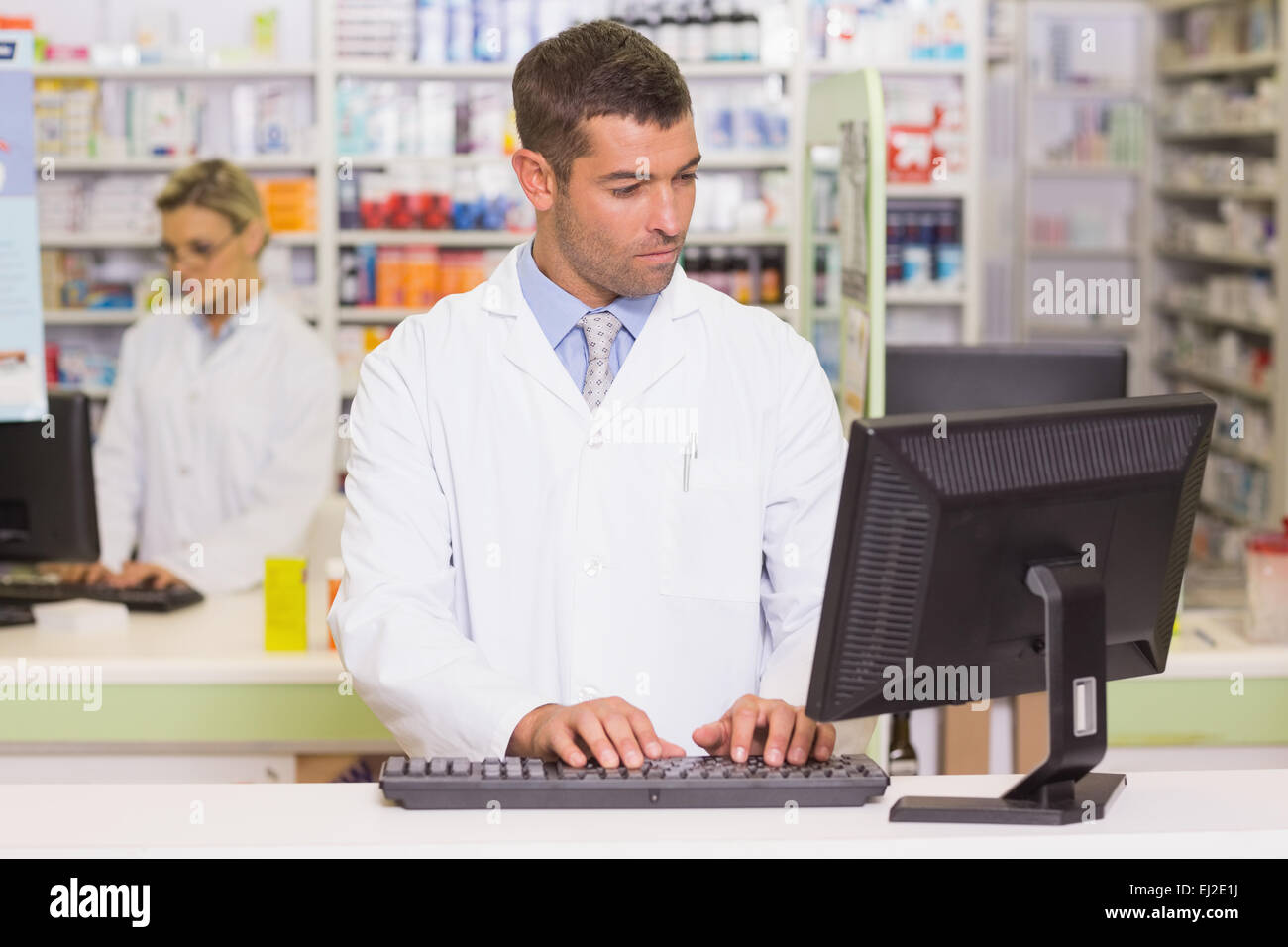 Pharmacist using monitor screen hi-res stock photography and images - Alamy