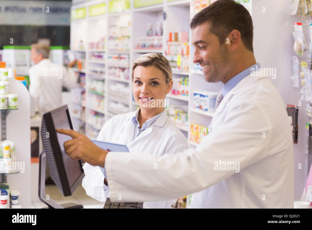 Man woman pharmacists using hi-res stock photography and images - Alamy