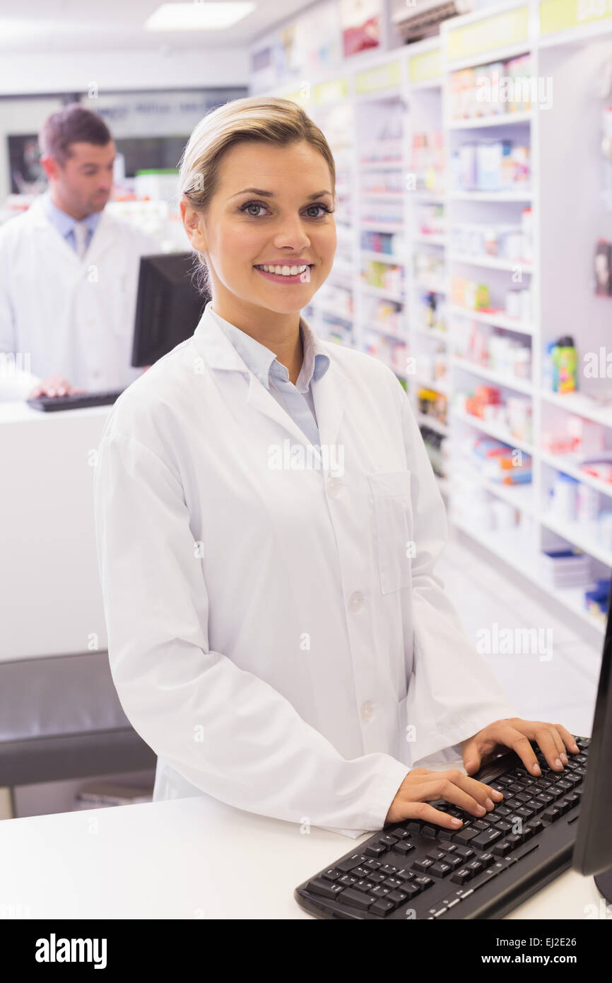 Pharmacist using the computer Stock Photo - Alamy