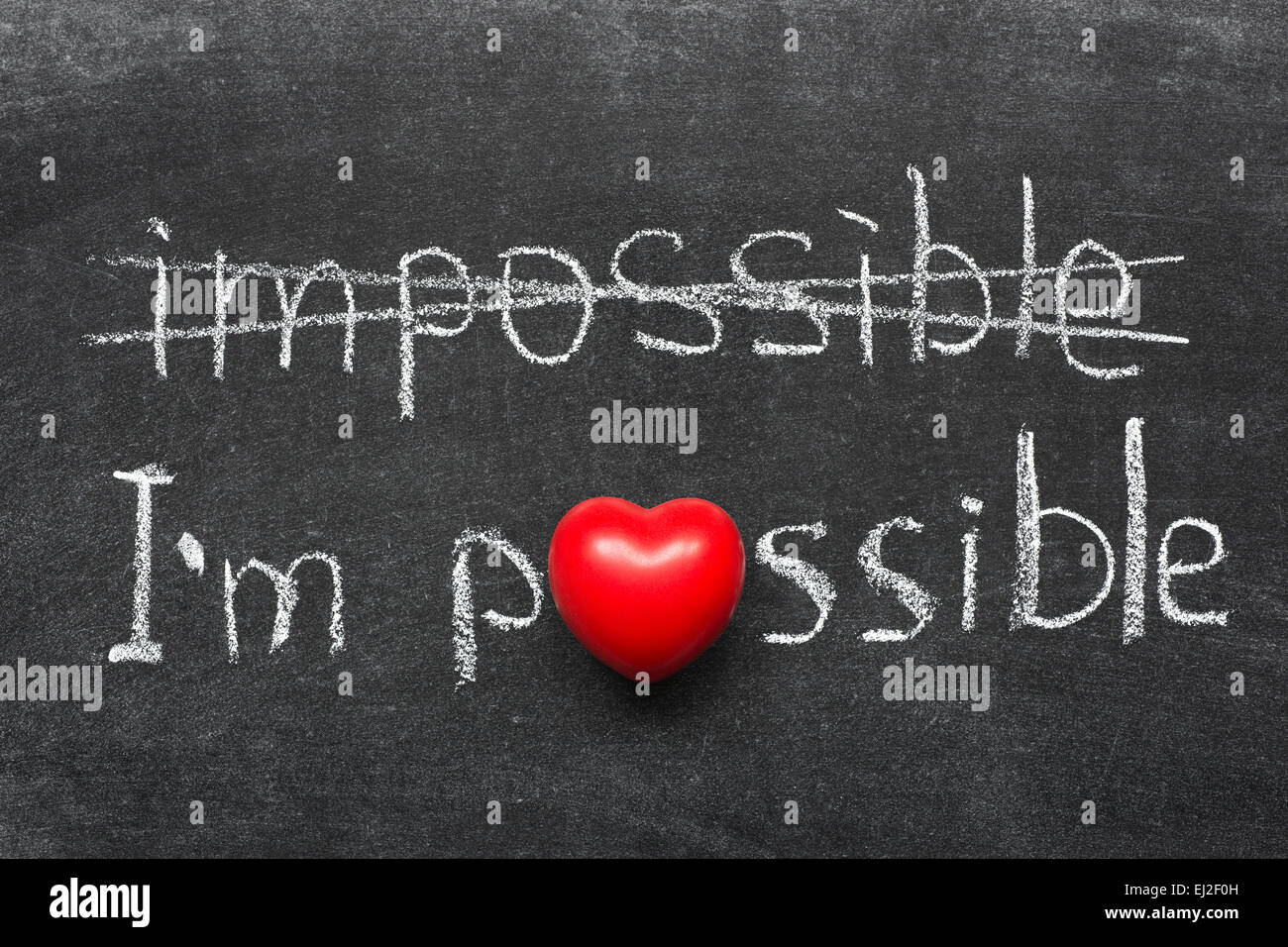 I am possible concept handwritten on blackboard with heart symbol ...