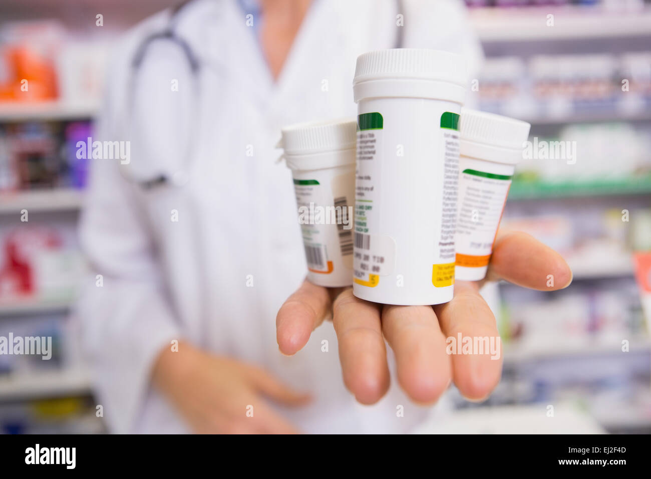 Hand pharmacist showing medicine jar hi-res stock photography and ...