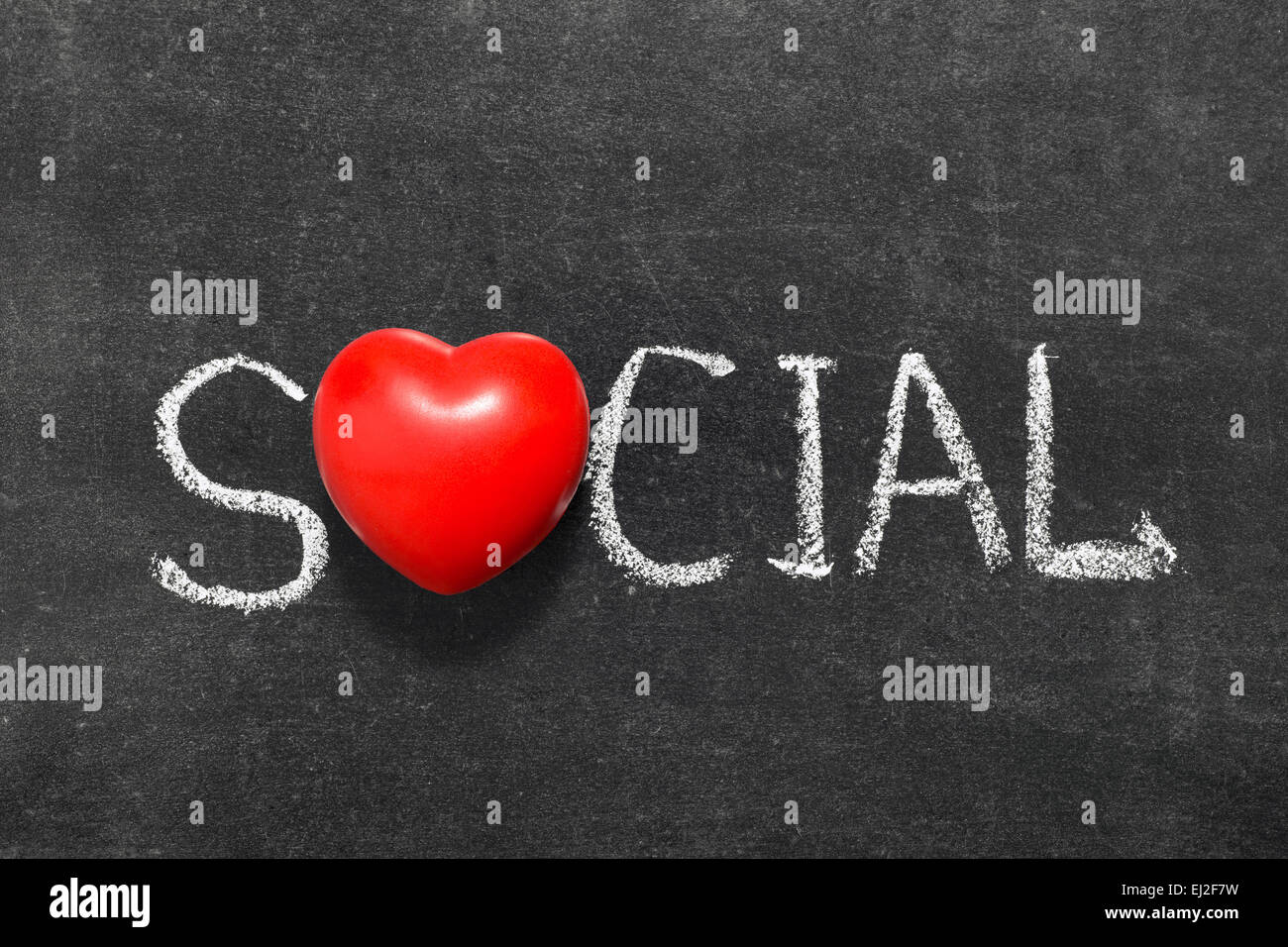 social word handwritten on blackboard with heart symbol instead of O ...