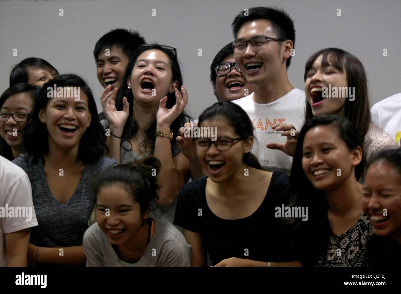 Quezon City, Philippines. 20th Mar, 2015. Students laugh as they ...