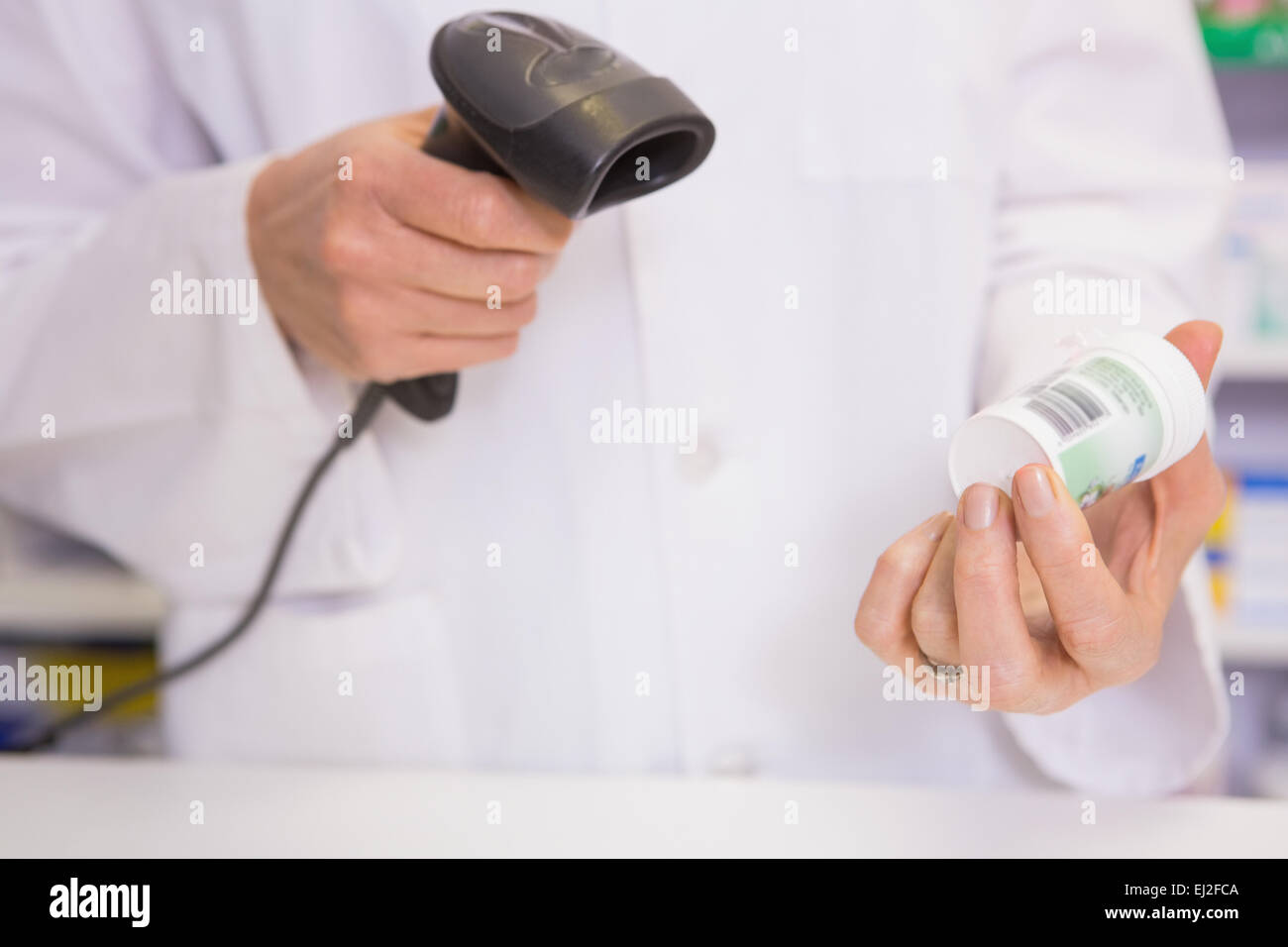 Pharmacist scanning medication scanner hi-res stock photography and ...
