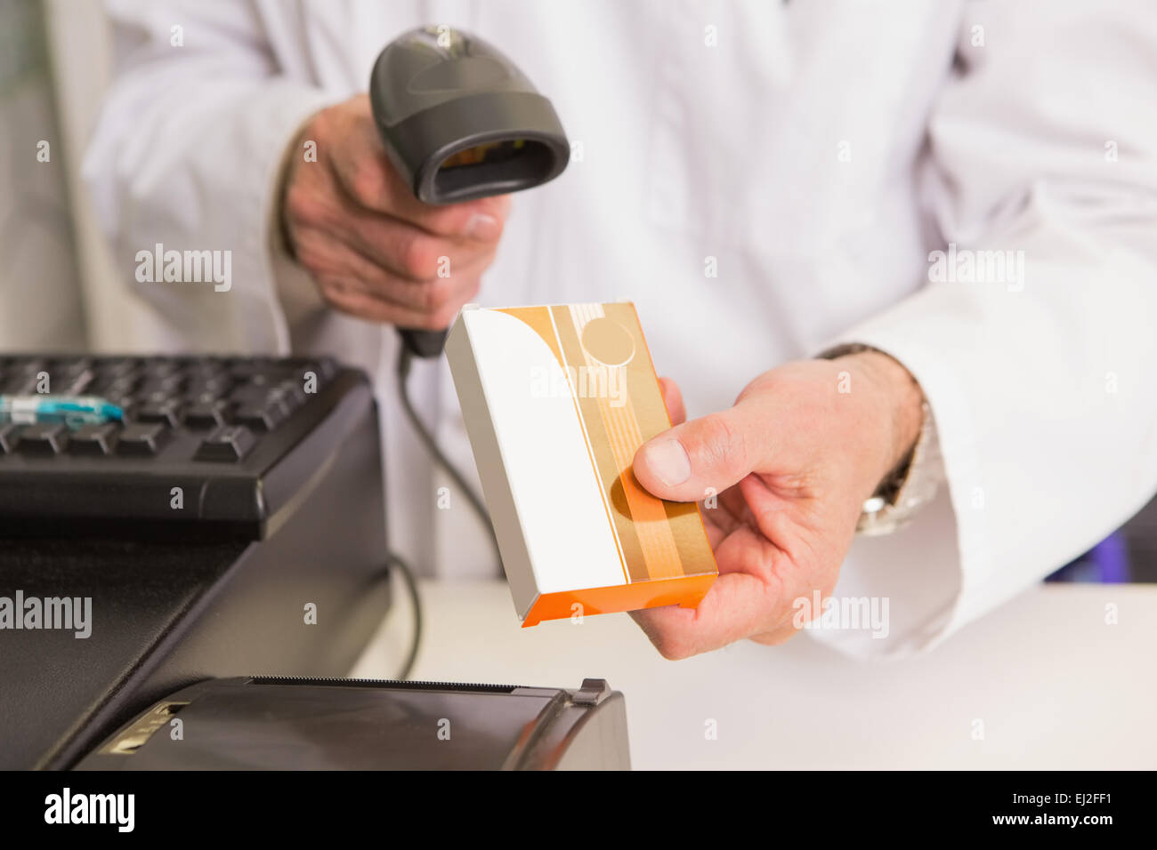 Pharmacist scanning medication with a scanner Stock Photo - Alamy