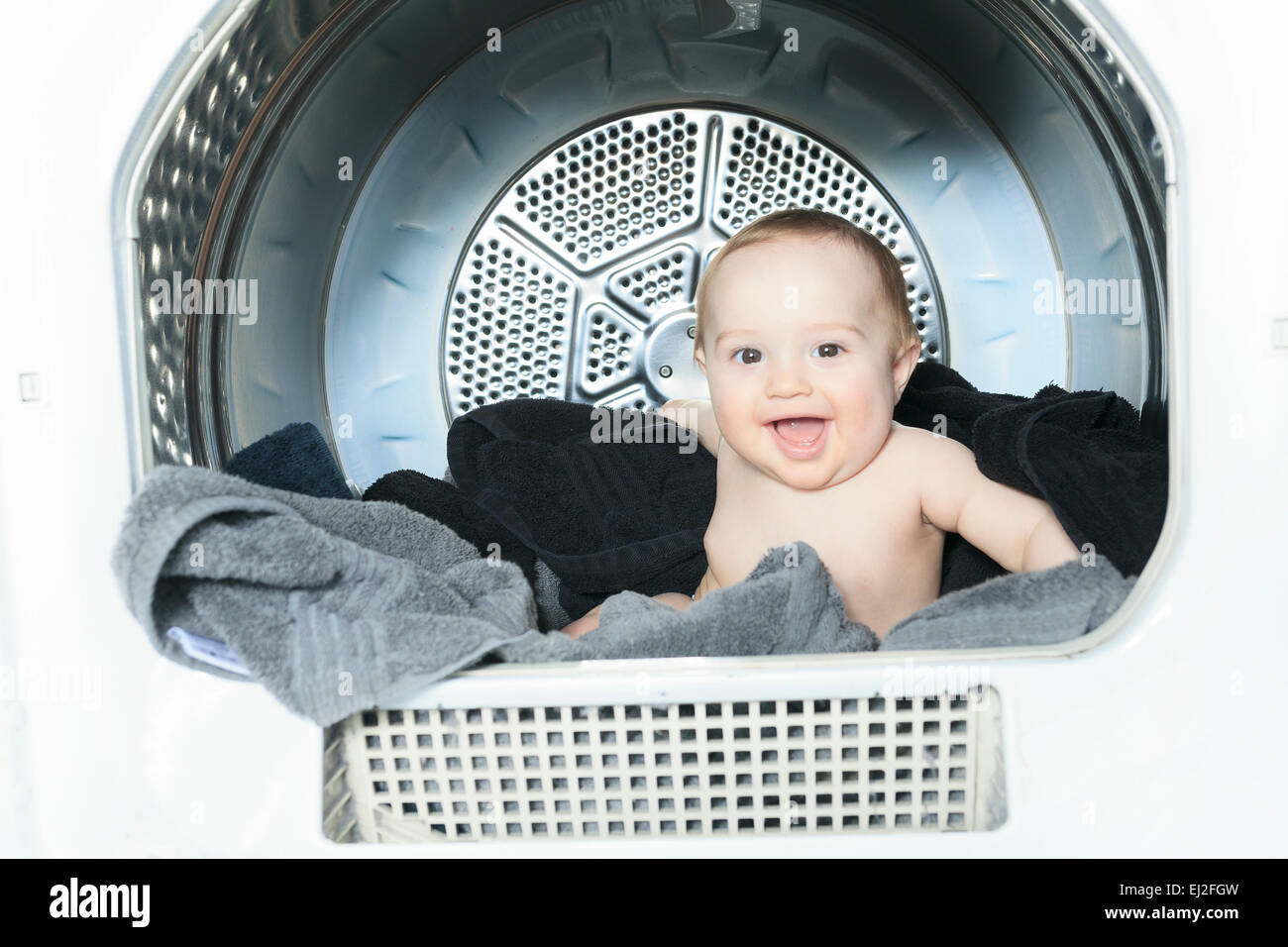 Child girl washing machine hi-res stock photography and images - Alamy