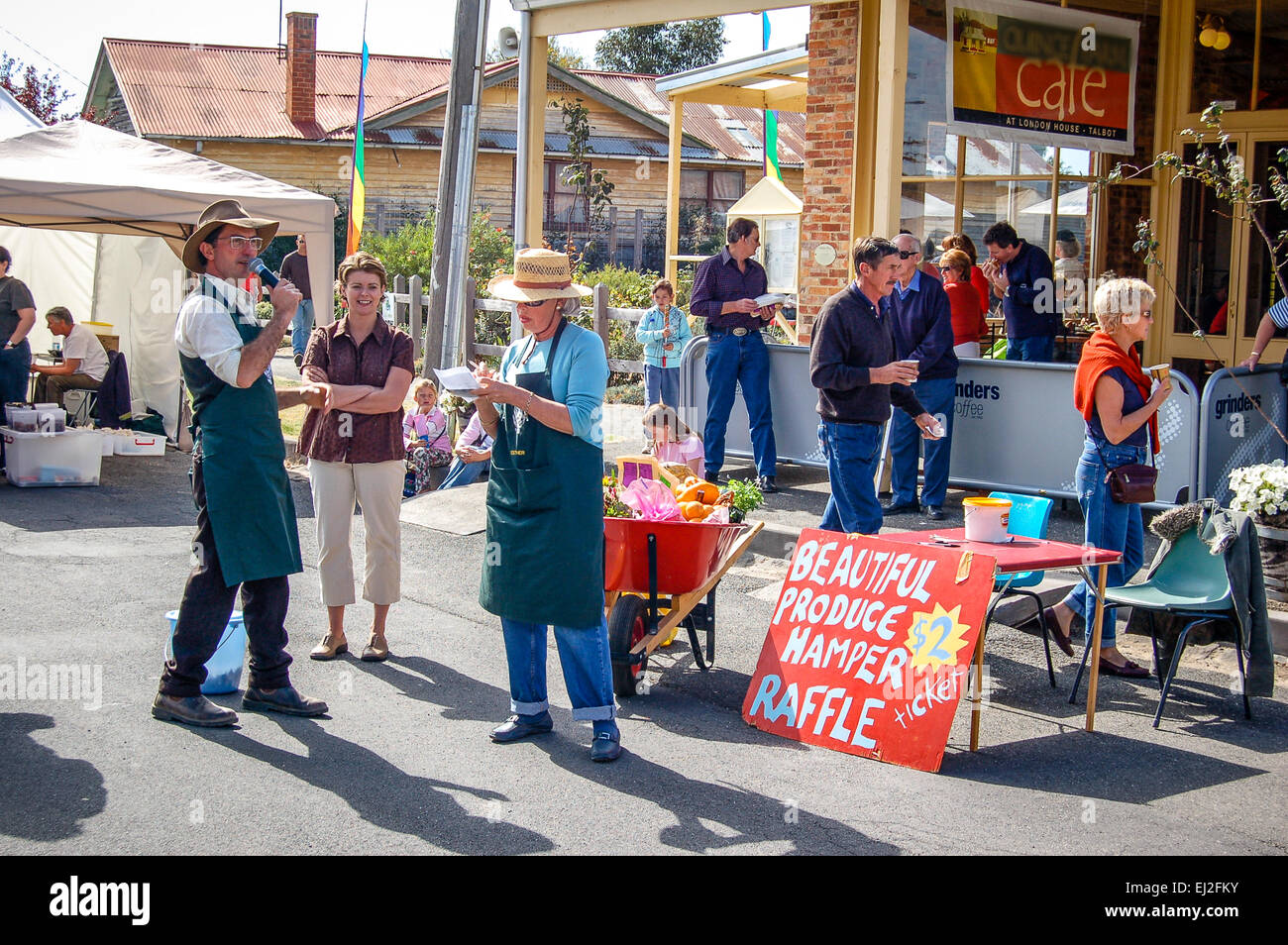 People participating in a food hamper raffle at the weekend market in ...