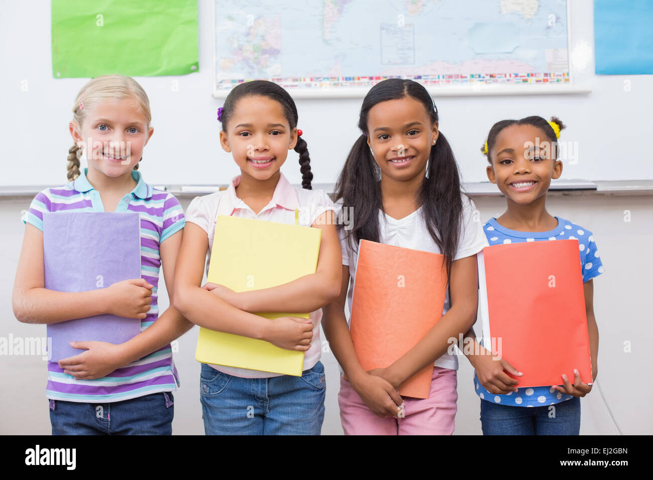 Cute pupils smiling at camera during class presentation Stock Photo - Alamy