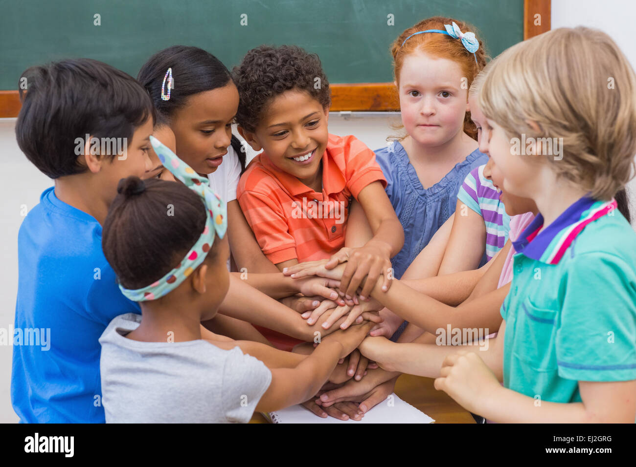 Cute pupils smiling in classroom Stock Photo - Alamy