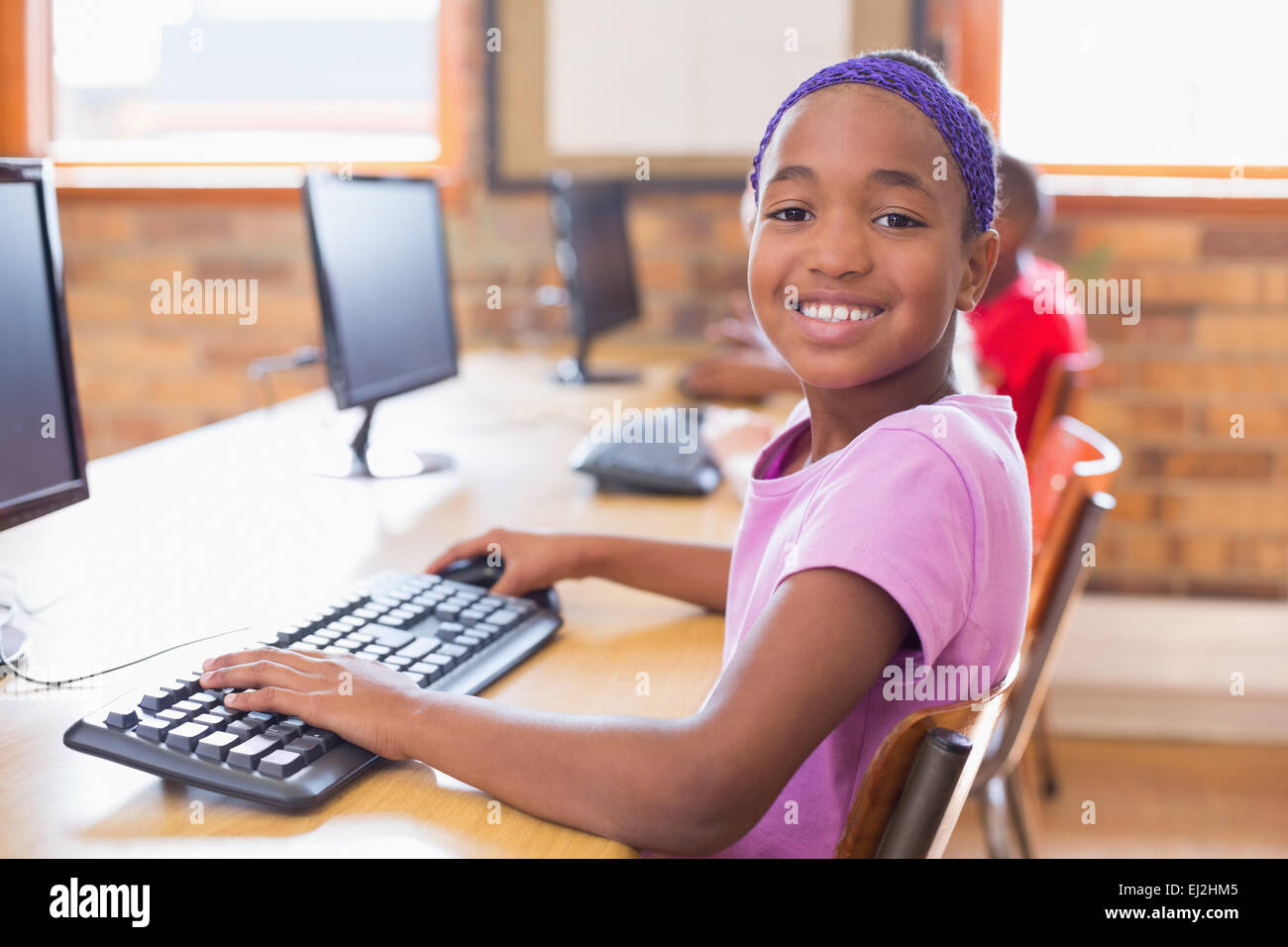 Cute pupils in computer class Stock Photo - Alamy