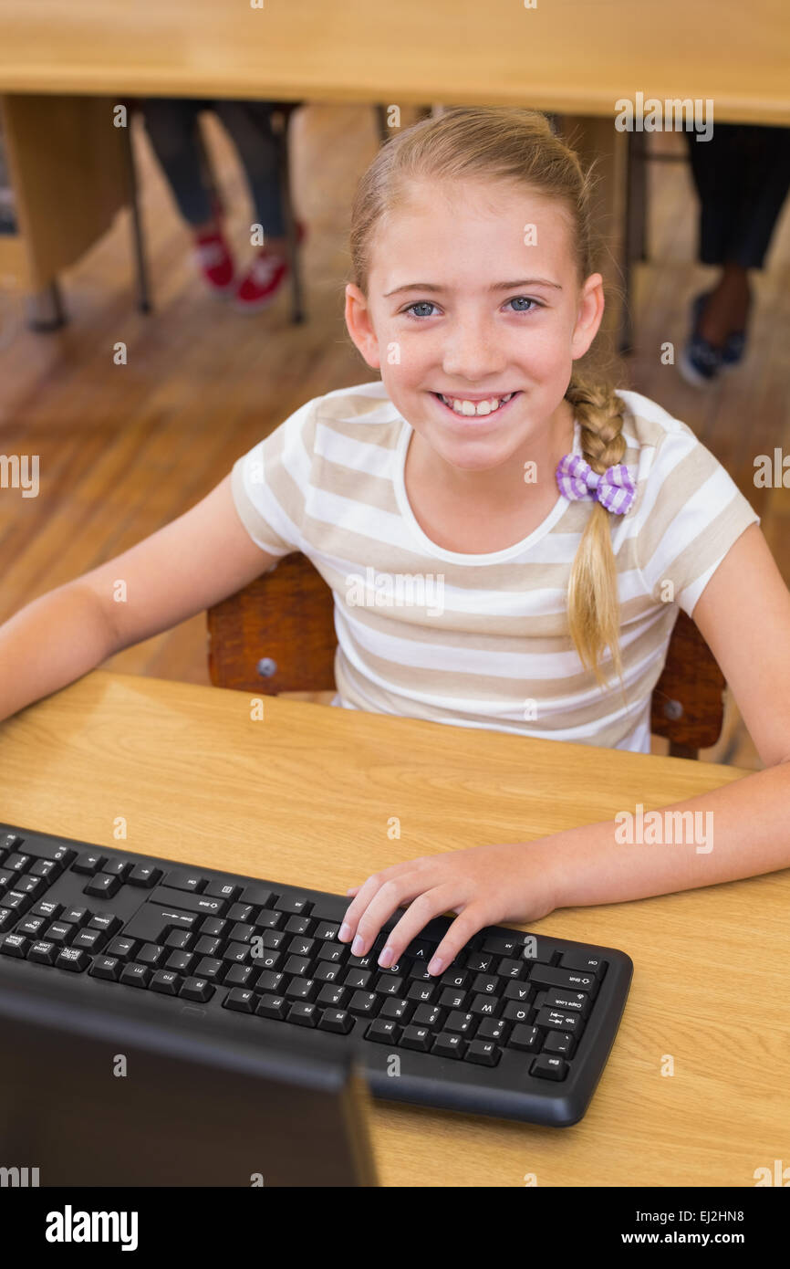 Cute pupil in computer class Stock Photo - Alamy