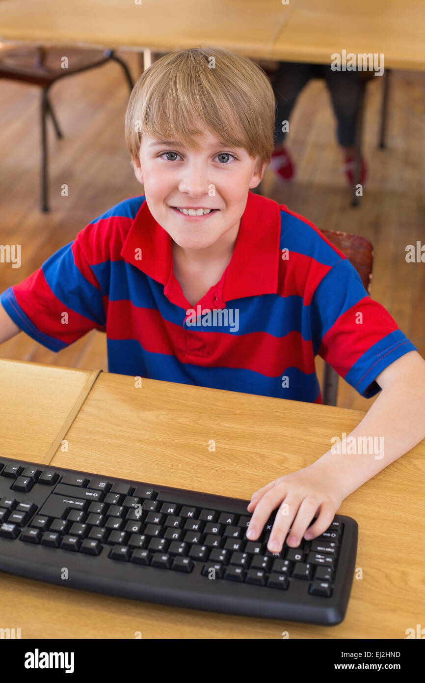 Cute pupil in computer class Stock Photo - Alamy