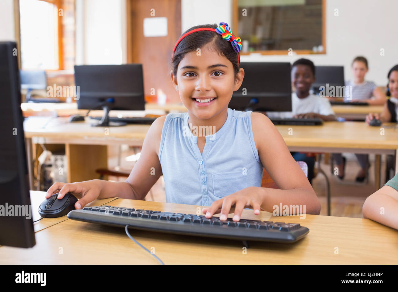 Cute pupils in computer class Stock Photo - Alamy