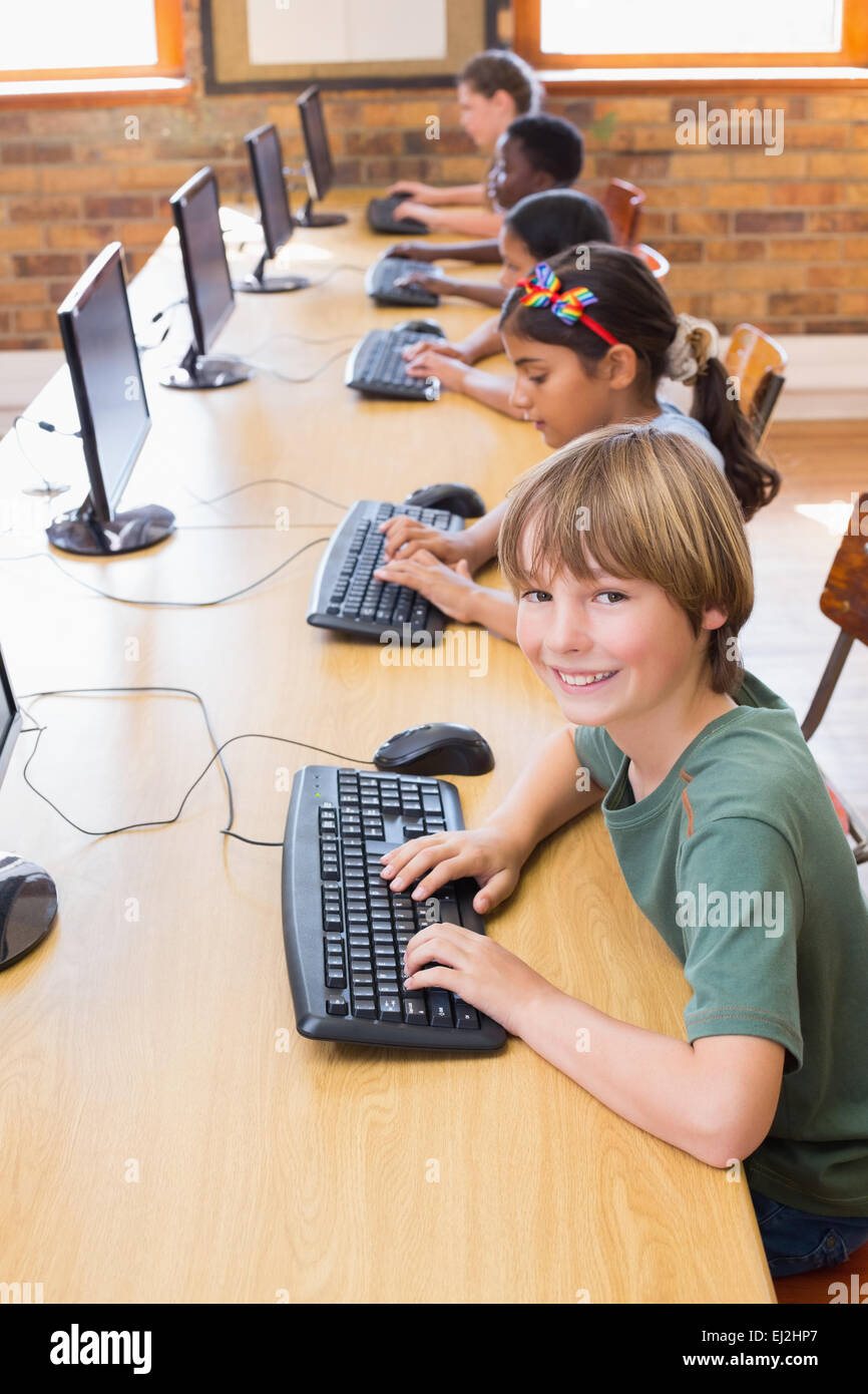 Cute pupils in computer class Stock Photo - Alamy