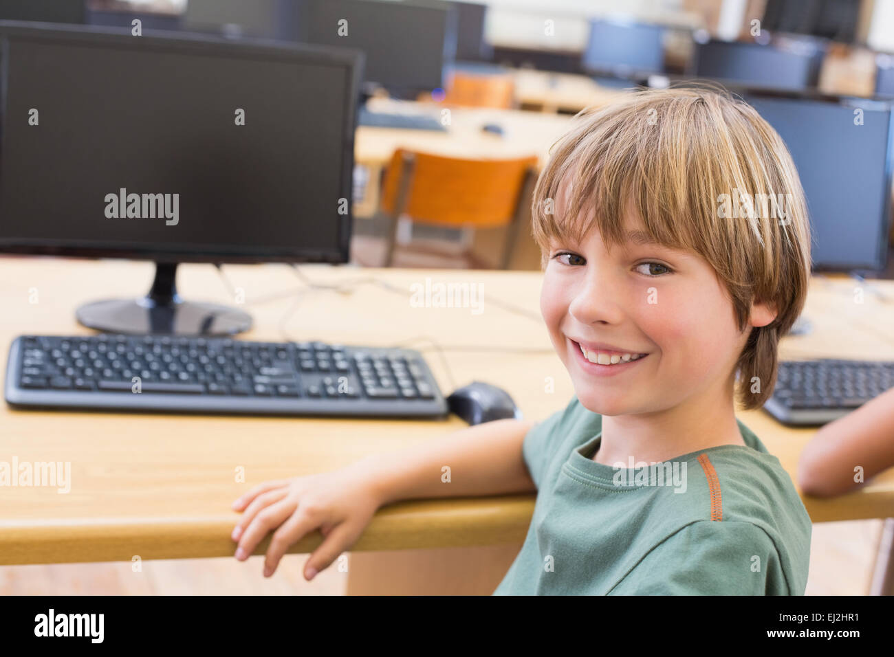 Cute pupil in computer class Stock Photo - Alamy