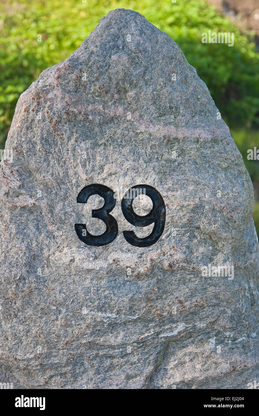 House number 39 in black on a granite rock Stock Photo - Alamy