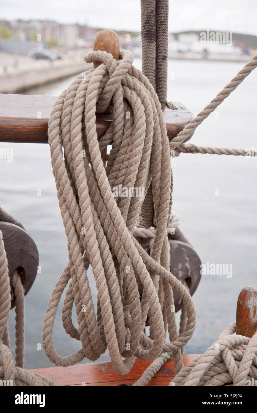 Ropes on belaying pins on board a tall ship Stock Photo - Alamy