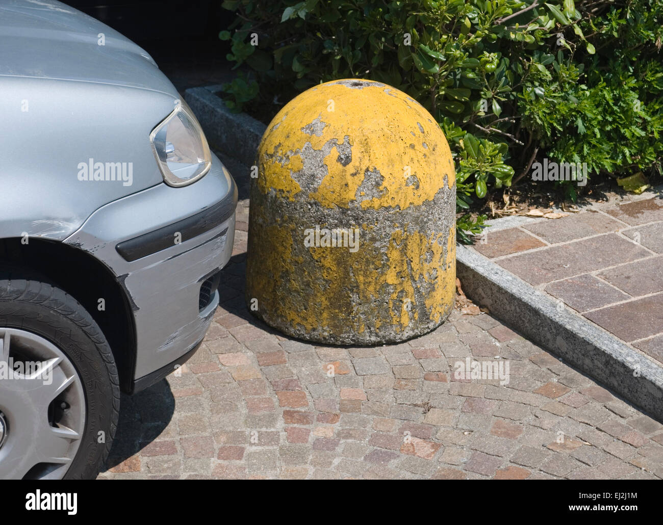 car and street bollard, Italy Stock Photo - Alamy