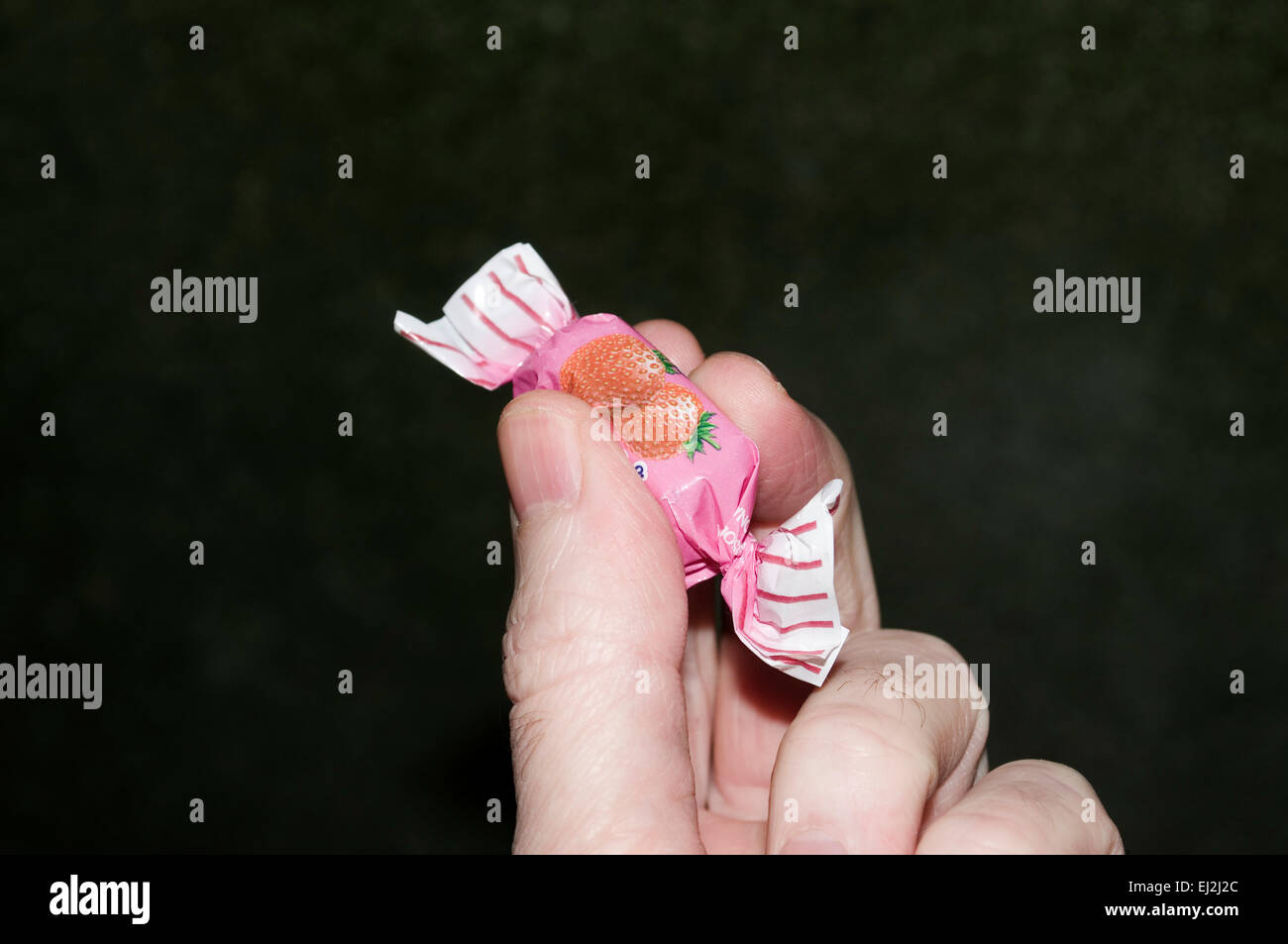 Offering a candy Stock Photo - Alamy