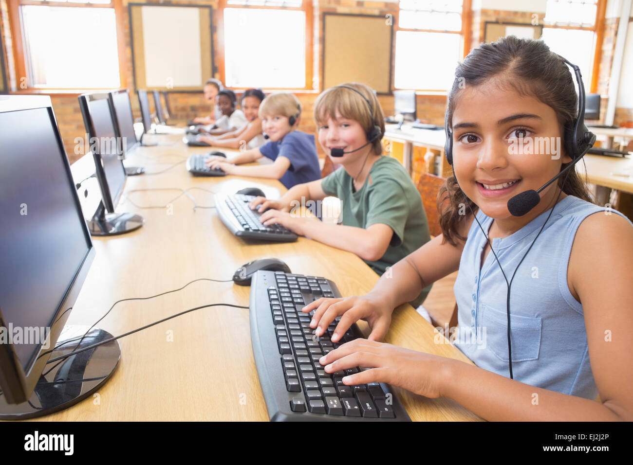 Cute pupils in computer class Stock Photo - Alamy
