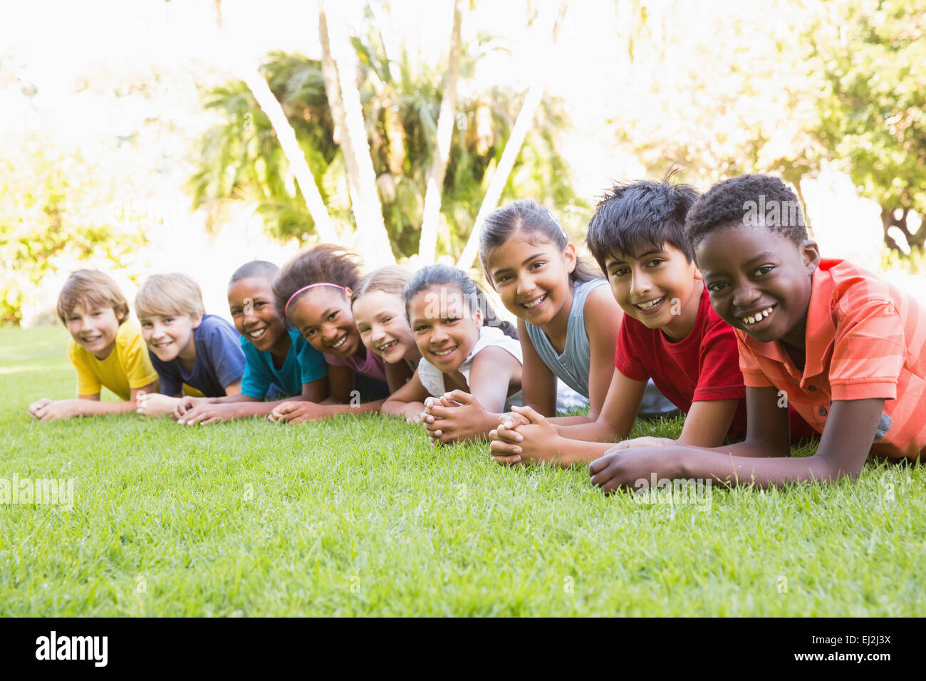 Happy friends in the park Stock Photo - Alamy