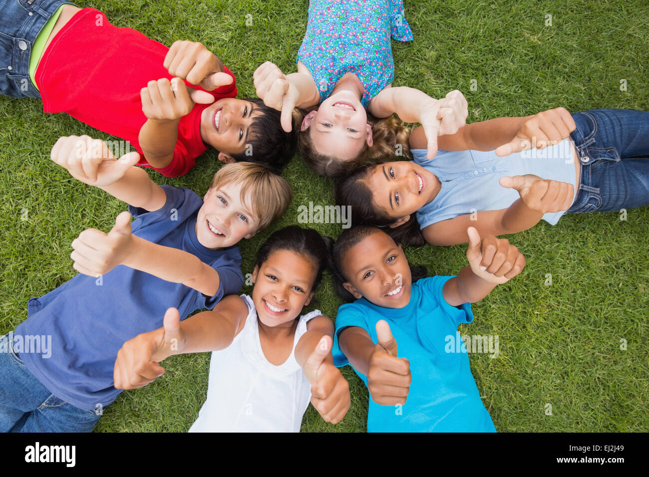 Happy friends playing in the park Stock Photo - Alamy