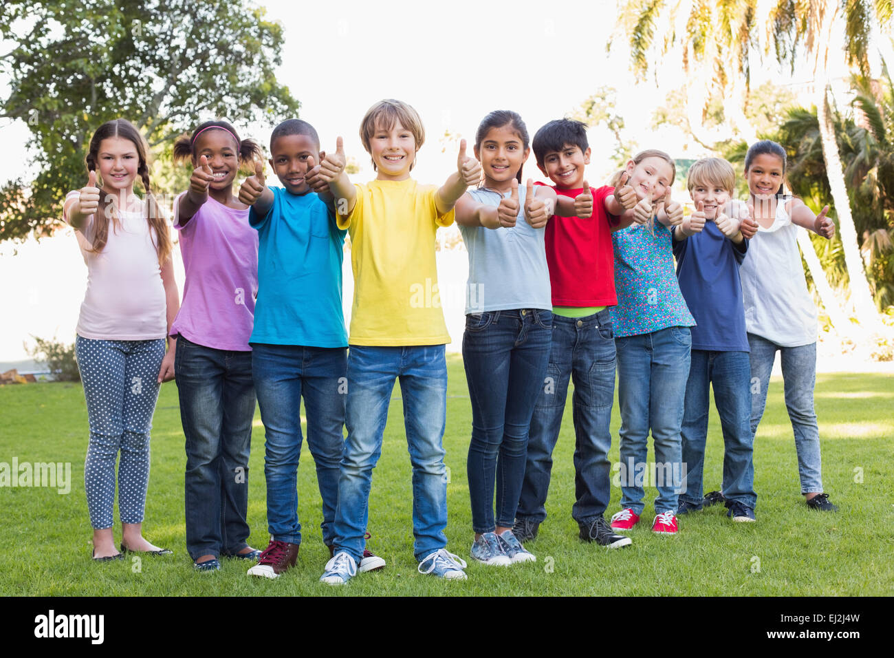 Happy friends playing in the park Stock Photo - Alamy