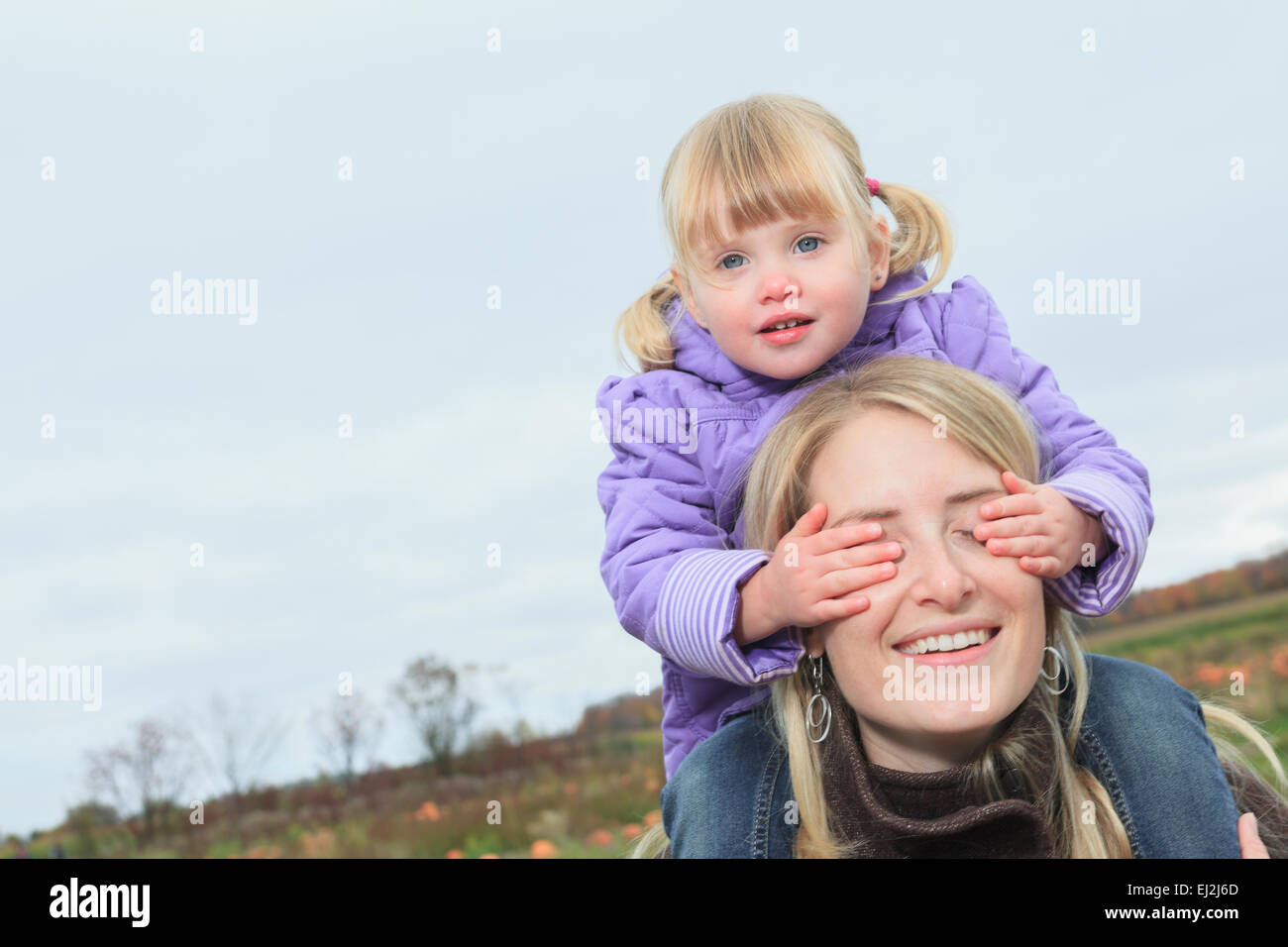 Mother giving daughter piggy back hi-res stock photography and images ...