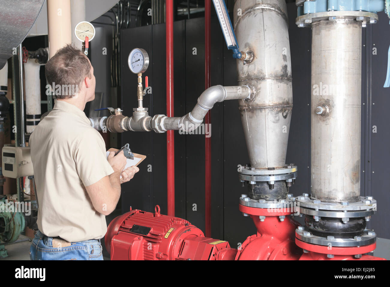Air Conditioner Repair Man at work Stock Photo - Alamy