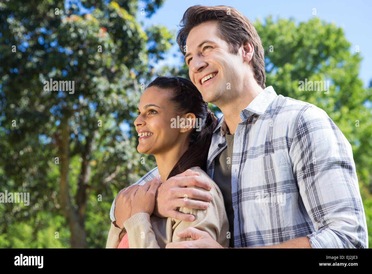 Happy young couple hugging park summer hi-res stock photography and ...