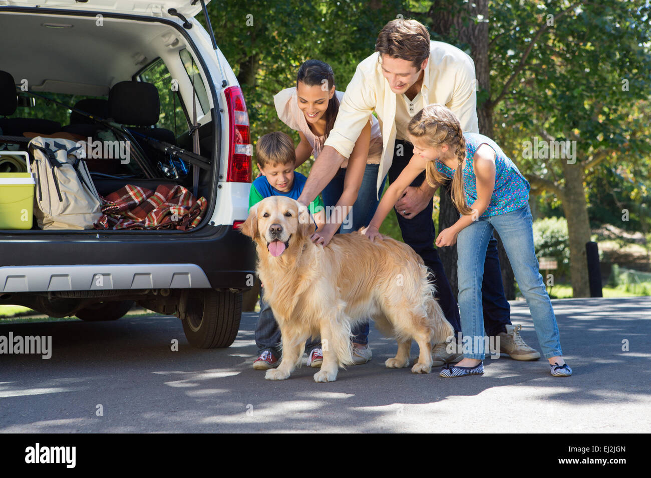Happy family getting ready for road trip Stock Photo - Alamy
