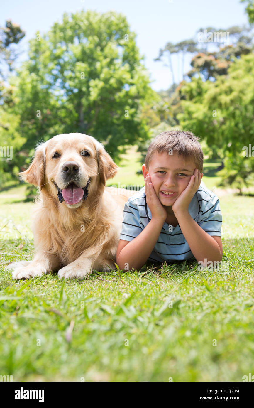 Little boy with his dog in the park Stock Photo - Alamy