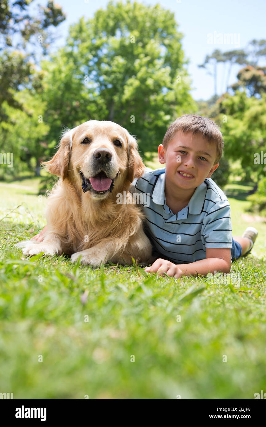 Little boy with his dog in the park Stock Photo - Alamy