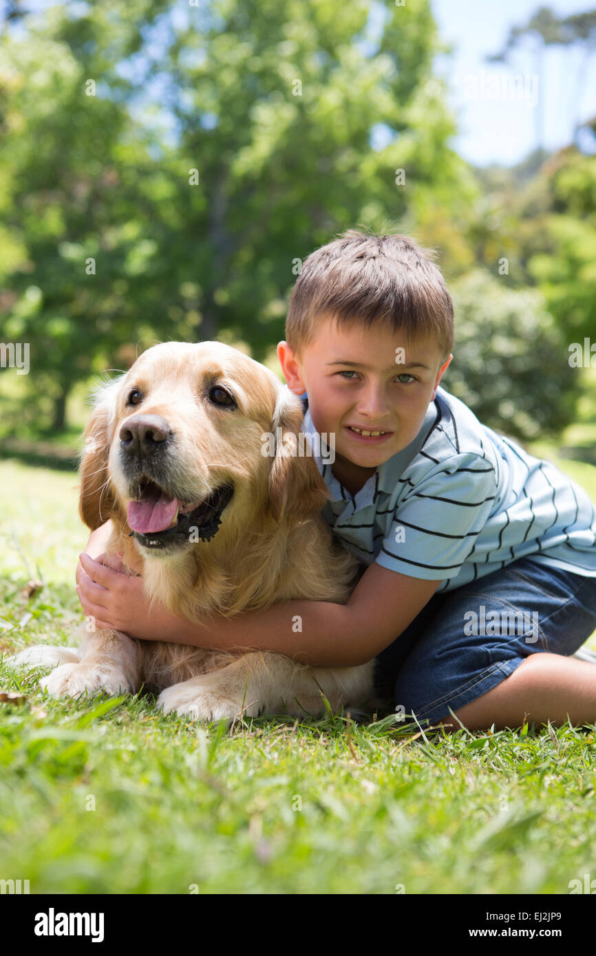 Little boy with his dog in the park Stock Photo - Alamy