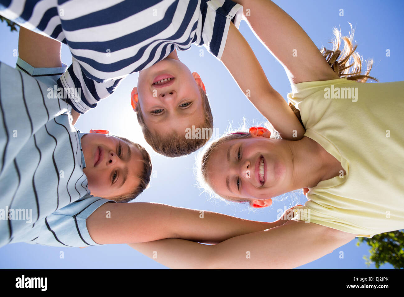 Happy siblings smiling at camera together Stock Photo - Alamy