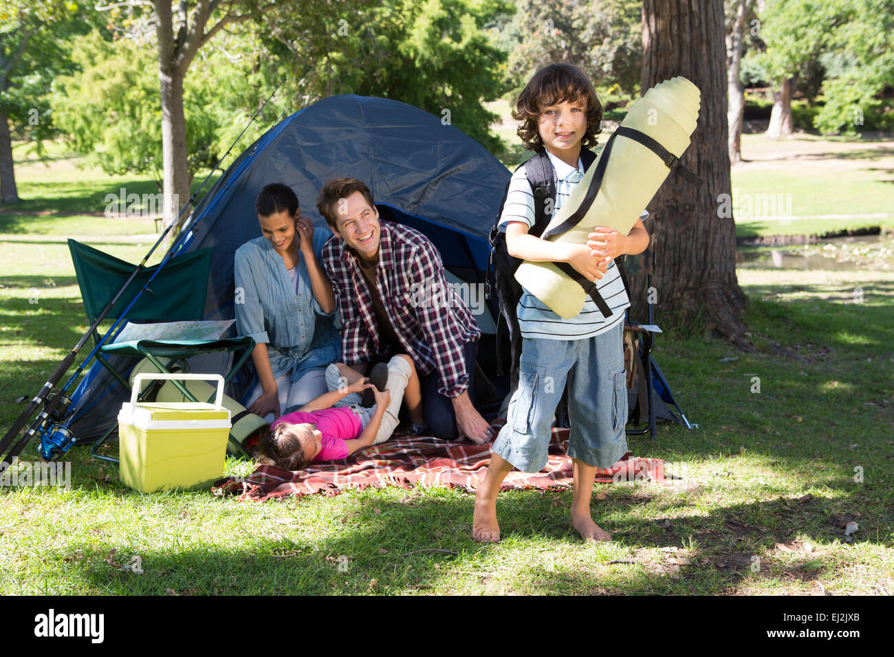 Happy family on a camping trip Stock Photo - Alamy