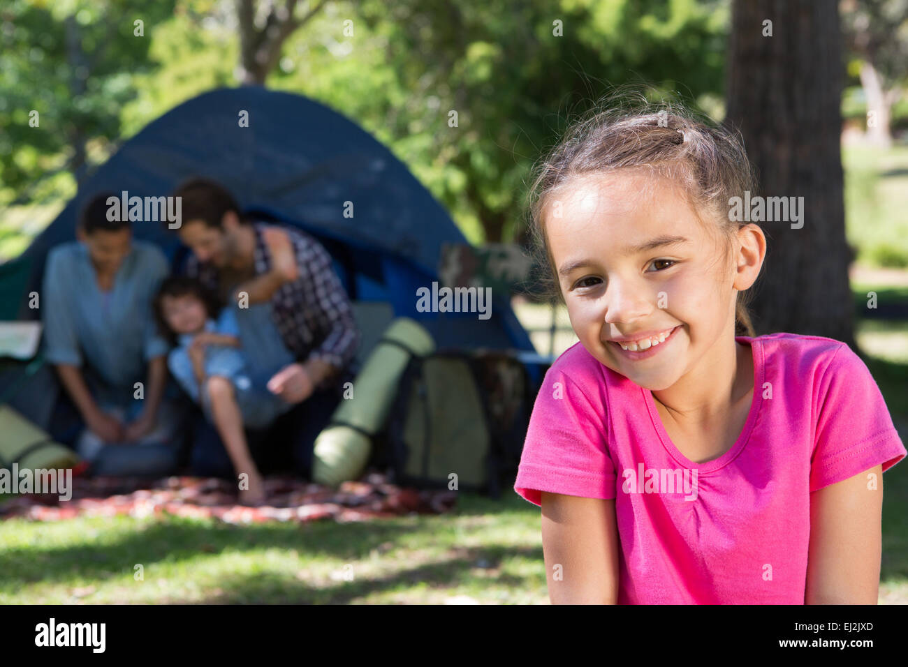 Happy family on a camping trip Stock Photo - Alamy
