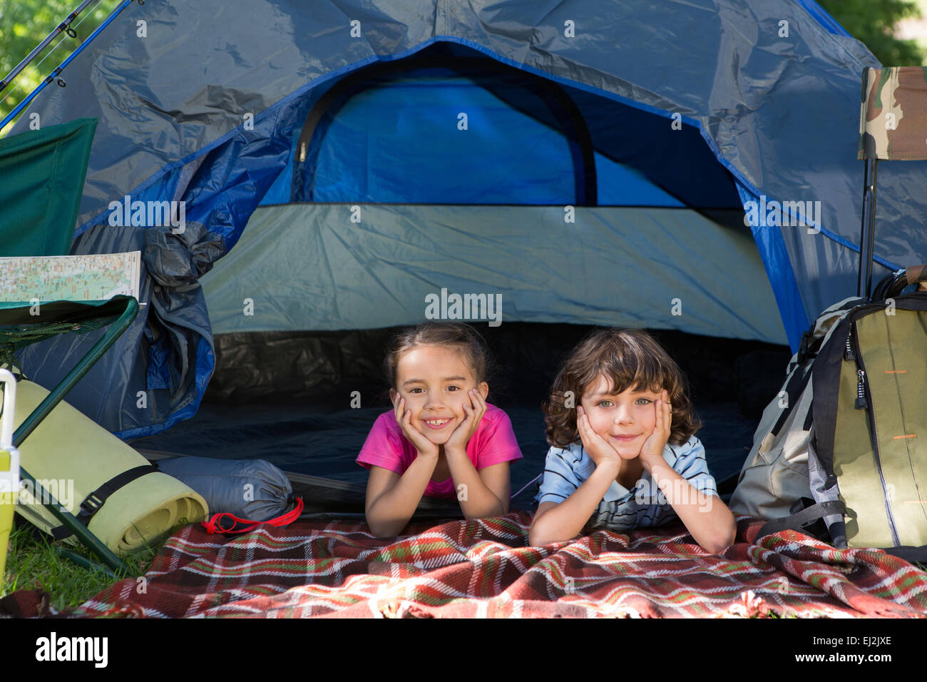 Happy siblings on a camping trip Stock Photo - Alamy